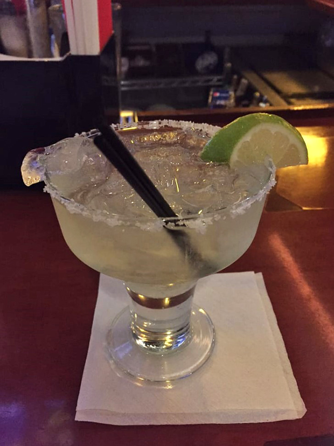 Liquid refreshment, elevated! This margarita isn't just a drink; it's a vacation in a glass, complete with a salty beach (on the rim).