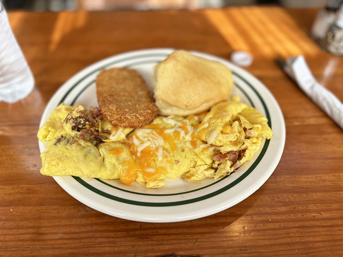 This omelet is so stuffed, it's practically the Thanksgiving turkey of breakfast. And that biscuit? It's the perfect supporting actor.