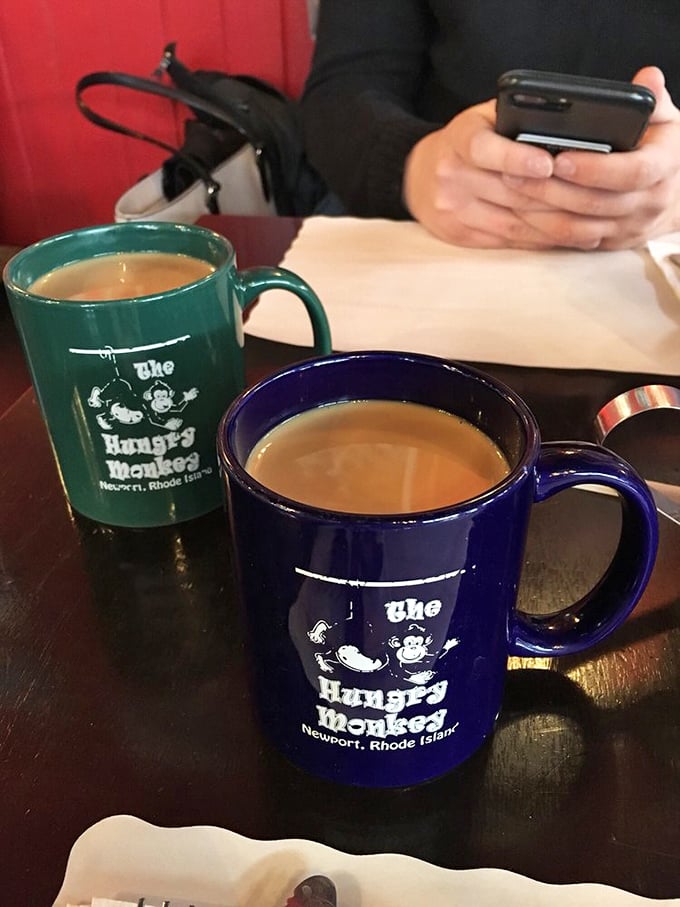 Coffee mugs with personality! These cheeky cups are ready to caffeinate you into monkey business - choose your fighter: green or blue?