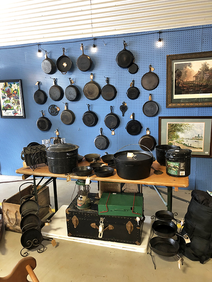 Holy cookware, Batman! This wall of cast iron skillets could fry enough eggs to feed the entire Justice League.