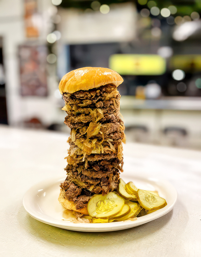 The leaning tower of deliciousness! This burger defies both gravity and willpower &ndash; resistance is futile.