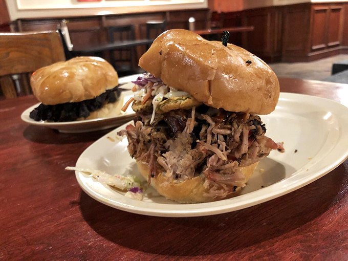 "The sandwich that eats like a meal!" This pulled pork masterpiece is piled so high, it's like the skyscraper of sandwiches - a meaty monument to barbecue brilliance.