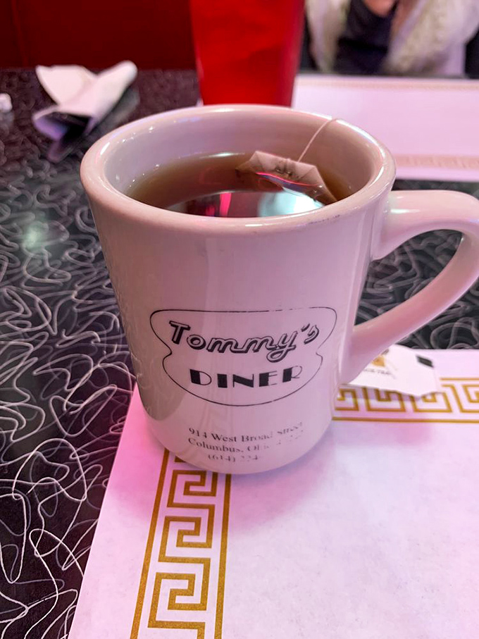 Sip, savor, repeat! Tommy's custom mug isn't just holding tea, it's cradling liquid comfort.