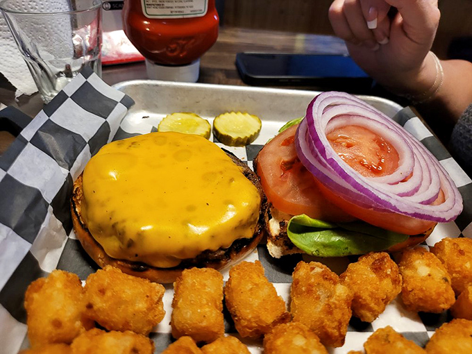 This isn't just a burger, it's a tower of flavor that'll have you planning your next visit before you've finished the first bite.