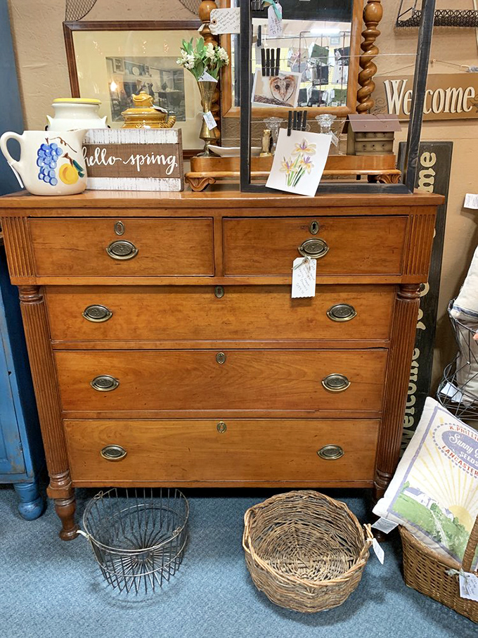 This isn't just a dresser; it's a time portal disguised as furniture. Open a drawer, and who knows what era you'll fall into? Spring has sprung on top!