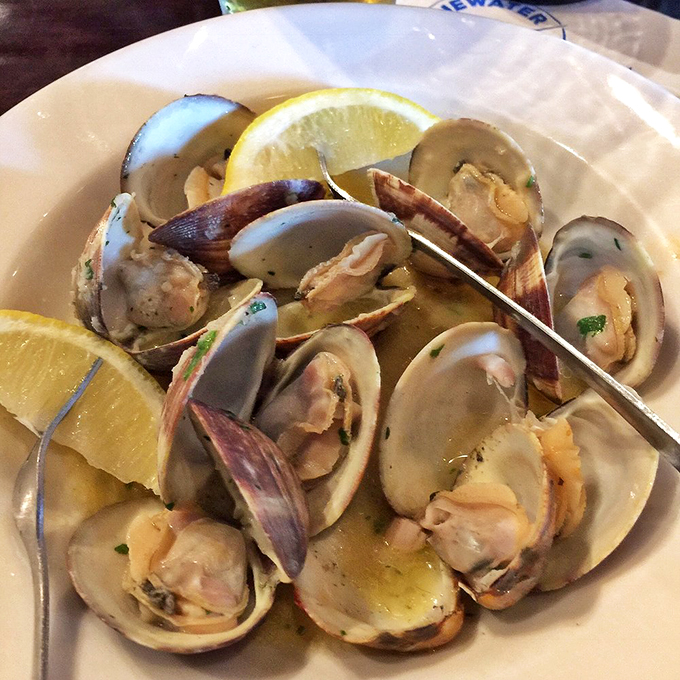 Clams bathed in buttery broth &ndash; it's like a day at the beach for your mouth. No sunscreen required, just bring your appetite.