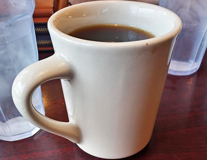 The elixir of life, served in a no-nonsense mug. This coffee isn't just a drink, it's a morning superhero, ready to vanquish sleepiness and conquer the day.