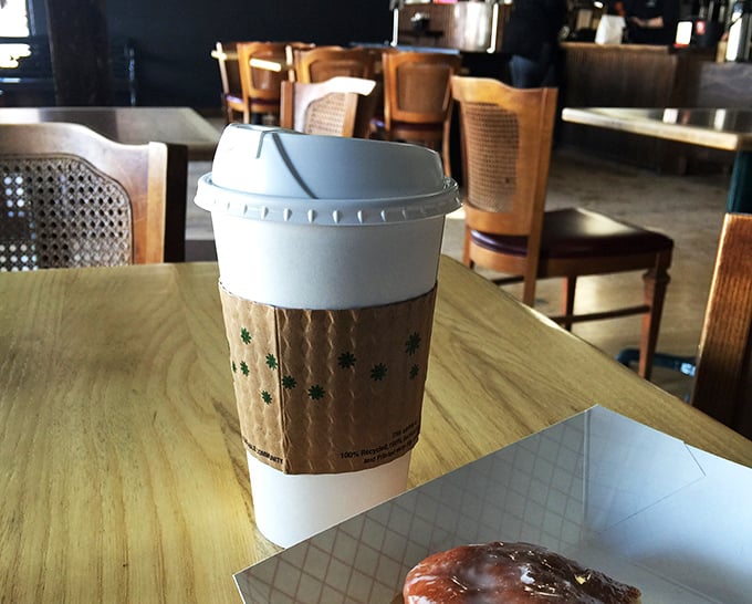 The perfect sidekick to your donut adventure! This coffee looks ready to fuel your sugar-fueled escapades. It's the Robin to your donut Batman.