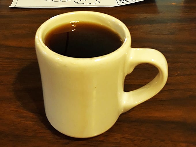 Ah, the elixir of life! This coffee mug holds the power to turn grumpy morning zombies into functioning humans. Use it wisely.