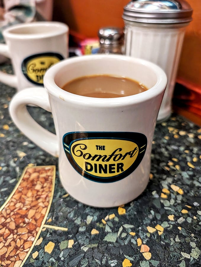 Coffee so good, it might make you a morning person. Served in a mug that screams "I've seen things" - mostly happy, hungry customers.