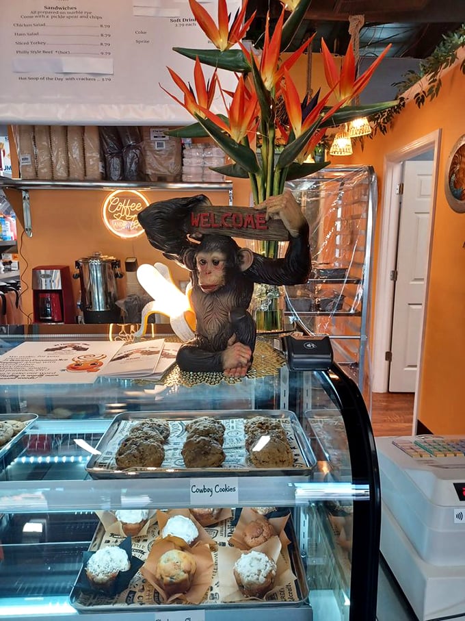 Monkey business at the counter! This cheeky greeter proves that at 21 Cinnamon Place, you're always in for a wild and tasty time.