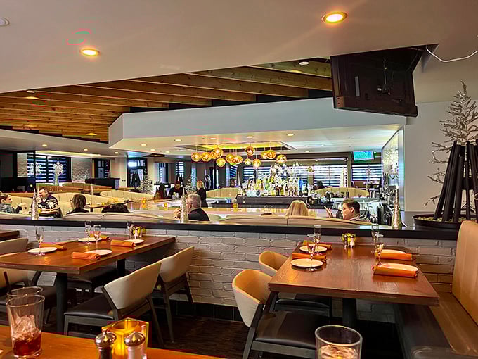 The dining area: where comfort meets style. It's like your living room got a makeover from a hip coastal designer.