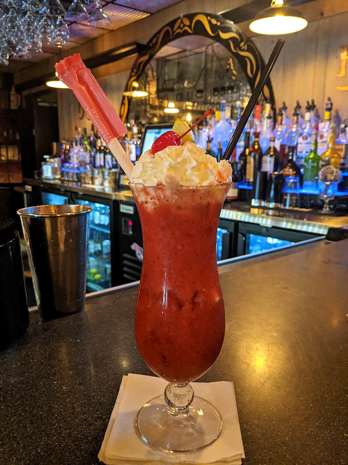 Is it a drink or a work of art? This cocktail is dressed to impress, complete with a cherry on top. Cheers to fancy sipping!