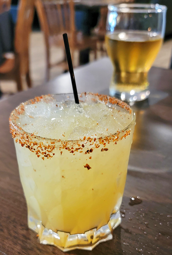 Cheers to good times! This zesty cocktail is like a party in a glass, complete with a spicy rim that'll wake up your taste buds.