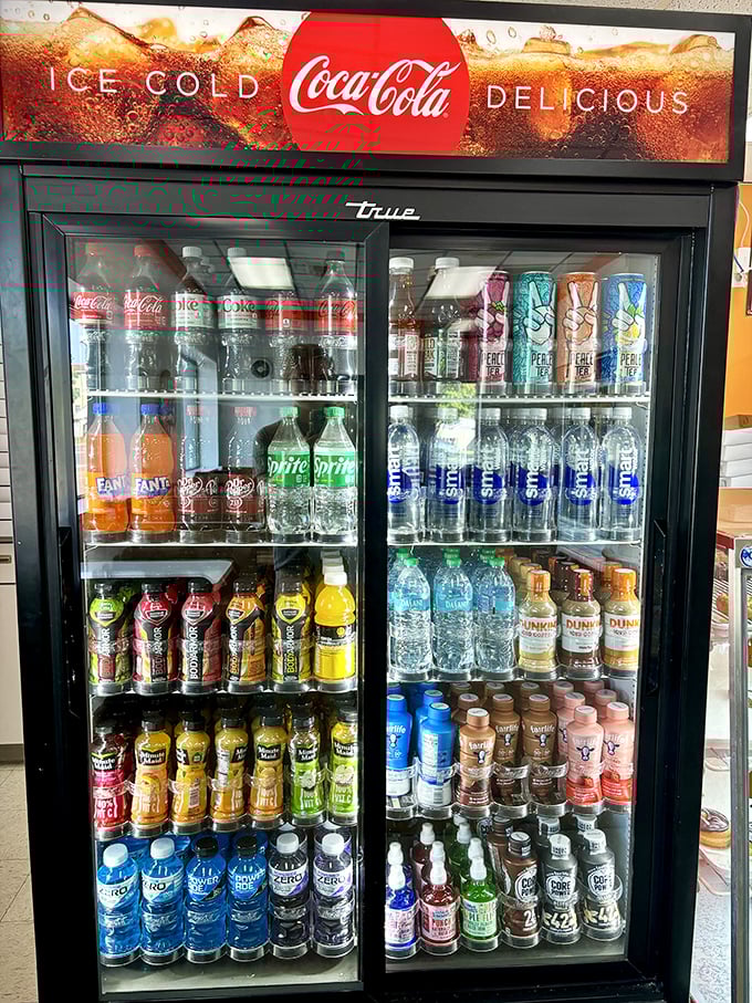 Liquid temptations galore! This fridge is stocked with enough sugary drinks to make a dentist weep and a kid cheer.