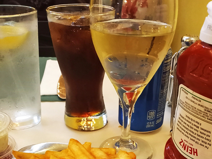 The holy trinity of dining pleasure: cold drinks, hot fries, and the anticipation of that first magnificent bite.