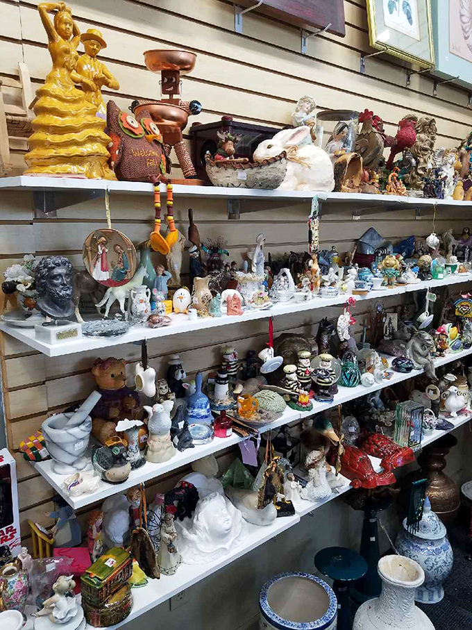 Tchotchke paradise! From religious figurines to decorative bunnies, this shelf represents America's collective knick-knack history in all its quirky glory.