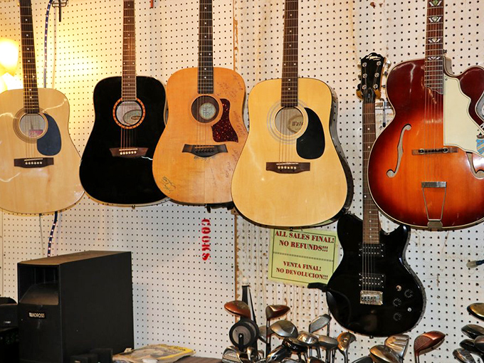 Strum a chord of nostalgia! This guitar wall is music to any rocker's eyes. From folk to funk, there's an ax here waiting to unleash your inner Eric Clapton.
