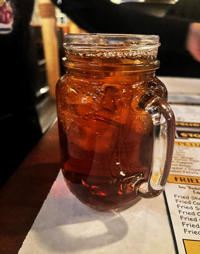 Quench your thirst with a mason jar of liquid amber. It's like summer in a glass, perfect for washing down those seafood delights.