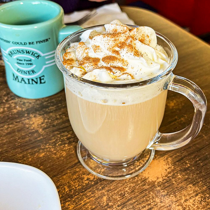 The Irish coffee arrives like a warm hug in a glass mug, topped with whipped cream mountains dusted with cinnamon foothills.