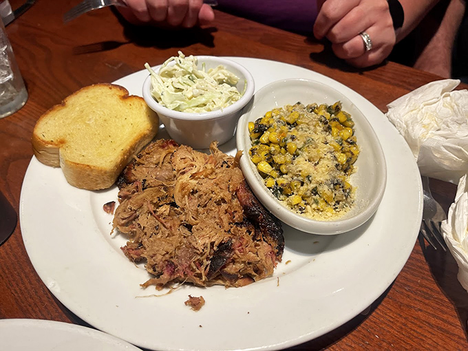 Pulled pork paradise! This plate is a Southern symphony of flavors, with each forkful promising a taste of BBQ heaven.