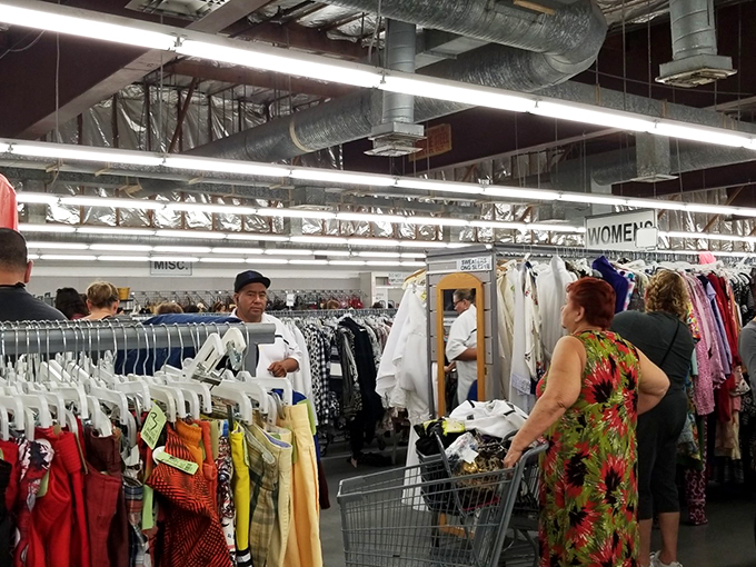 Treasure hunters in their natural habitat. Watch as they navigate the aisles, their carts filling with unexpected delights.