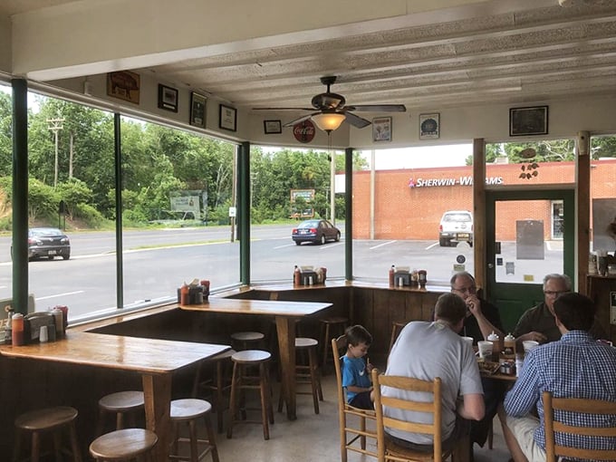Pull up a chair and join the feast! This cozy dining area is where BBQ enthusiasts become family, bonding over shared love for smoky goodness.