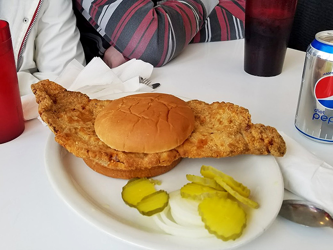 The tenderloin sandwich: Where the bun is merely a suggestion and the pickle chips are living their best life.