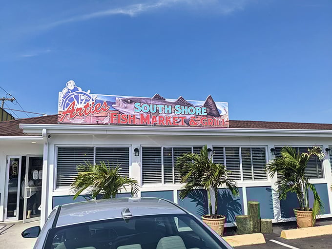 Blue skies and fish fries! Artie's cheerful exterior promises a seafood adventure that's fresher than a mermaid's playlist.