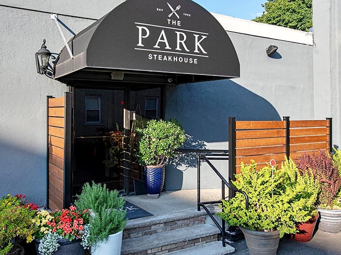 The Park Steakhouse: Where flowers bloom and flavors boom! This unassuming entrance leads to a garden of meaty delights.
