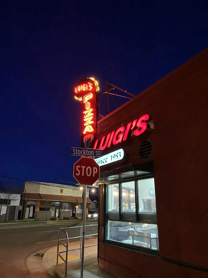 By day, it's a quaint corner spot. By night, Luigi's neon sign transforms into a beacon of cheesy hope for pizza lovers everywhere.