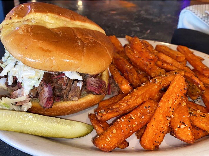 The sandwich that dreams are made of! This brisket beauty is piled high enough to make you wonder if you've stumbled into a meat skyscraper.