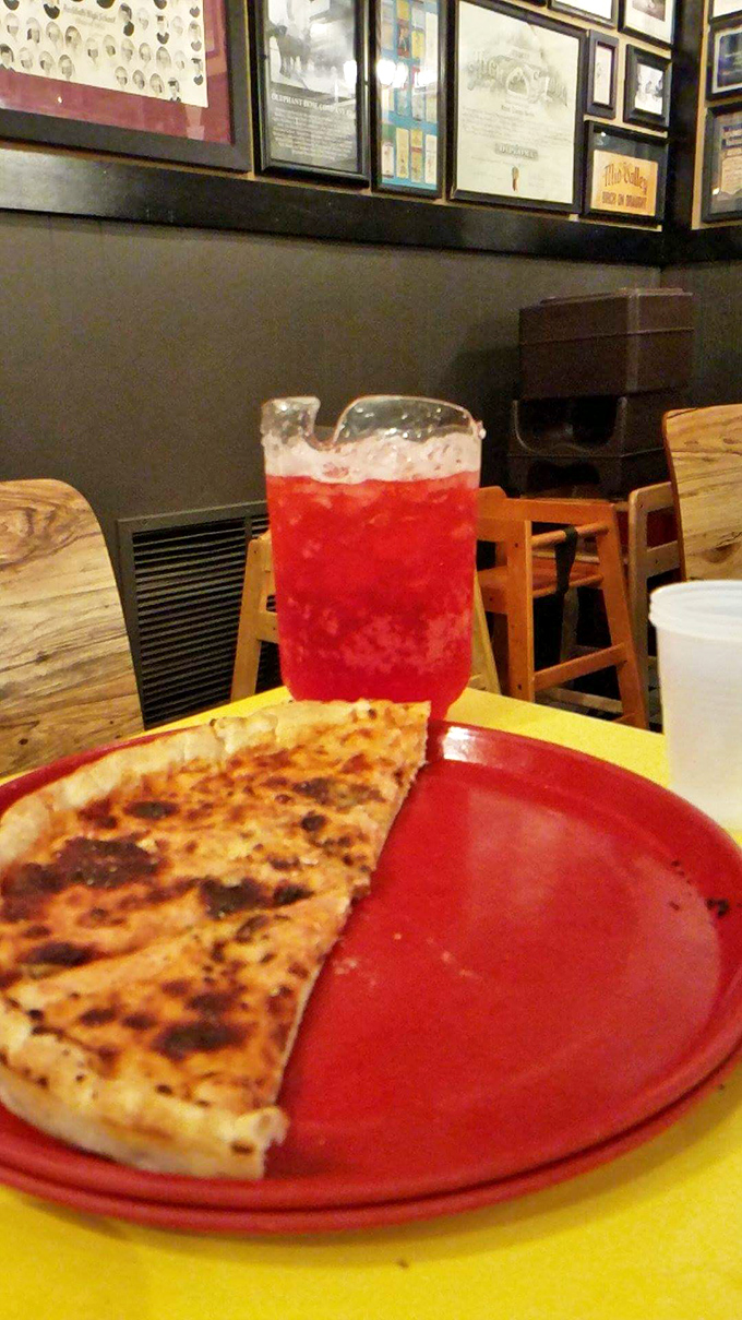 A slice of heaven on a plate! This pizza and drink combo is the Batman and Robin of comfort food duos.