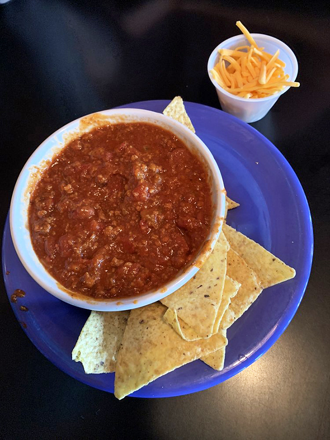 This chili looks hotter than a summer sidewalk in Texas! Grab a spoon and prepare for a flavor explosion.