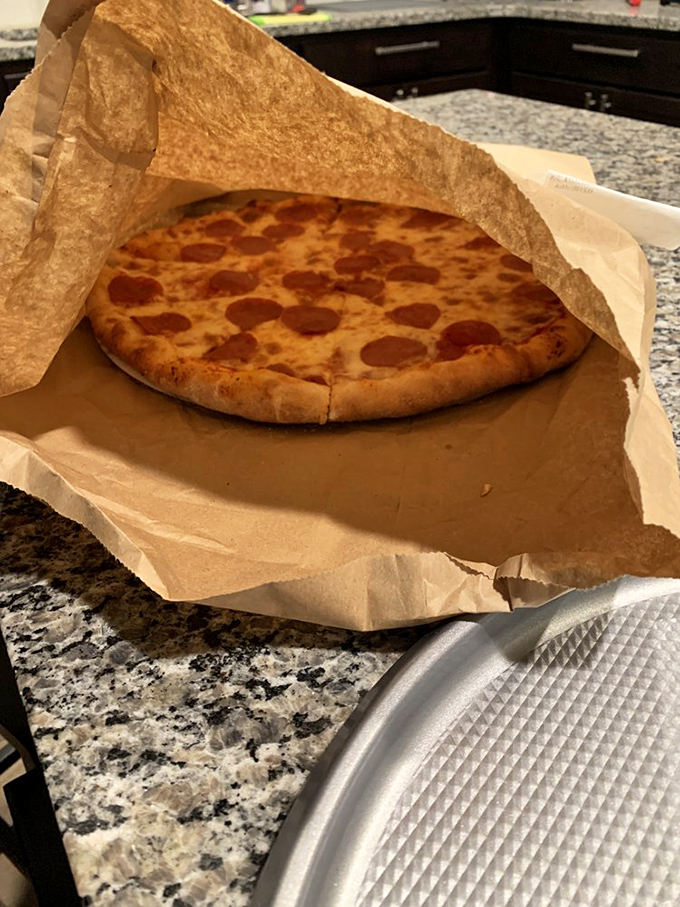 Takeout never looked so tempting. This pizza-to-go is dressed in paper, but it's the belle of the ball.