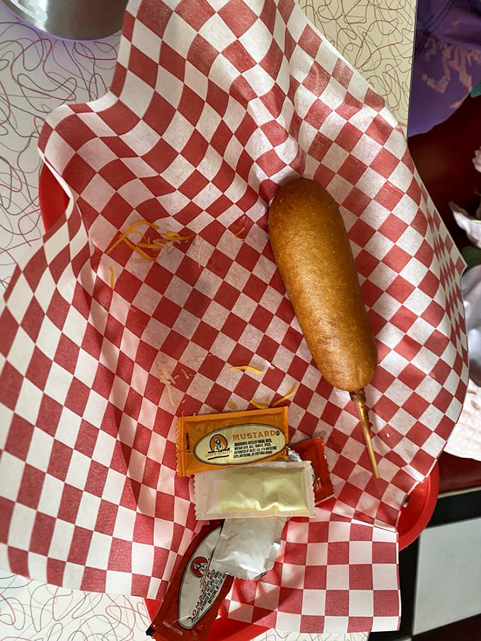 On a stick and ready to rock! This corn dog is the ultimate handheld happiness, no carnival required.