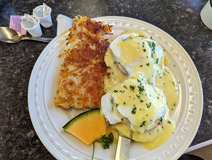 Eggs Benedict that would make the Pope jealous! These heavenly poached eggs are nestled on a throne of crispy hash browns.