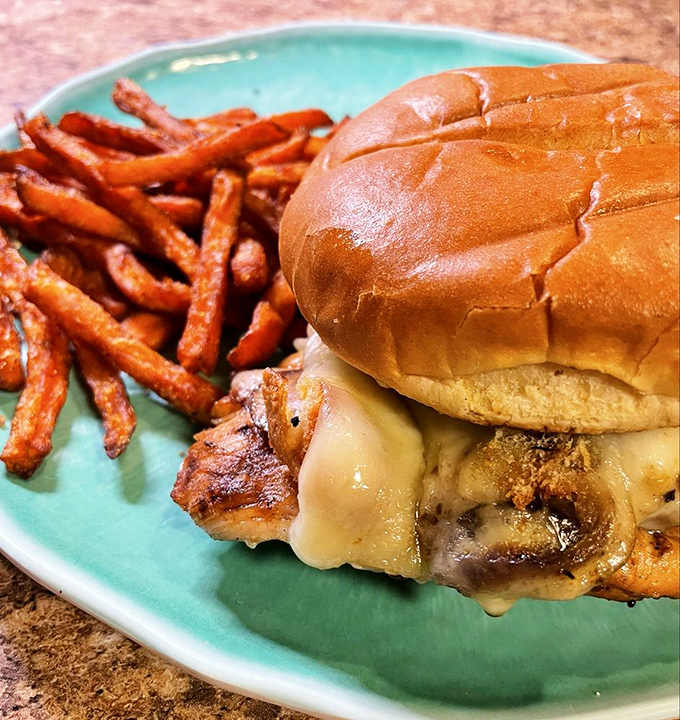 This burger isn't just photogenic &ndash; it's the kind that requires strategic planning before the first bite to avoid delicious chaos.