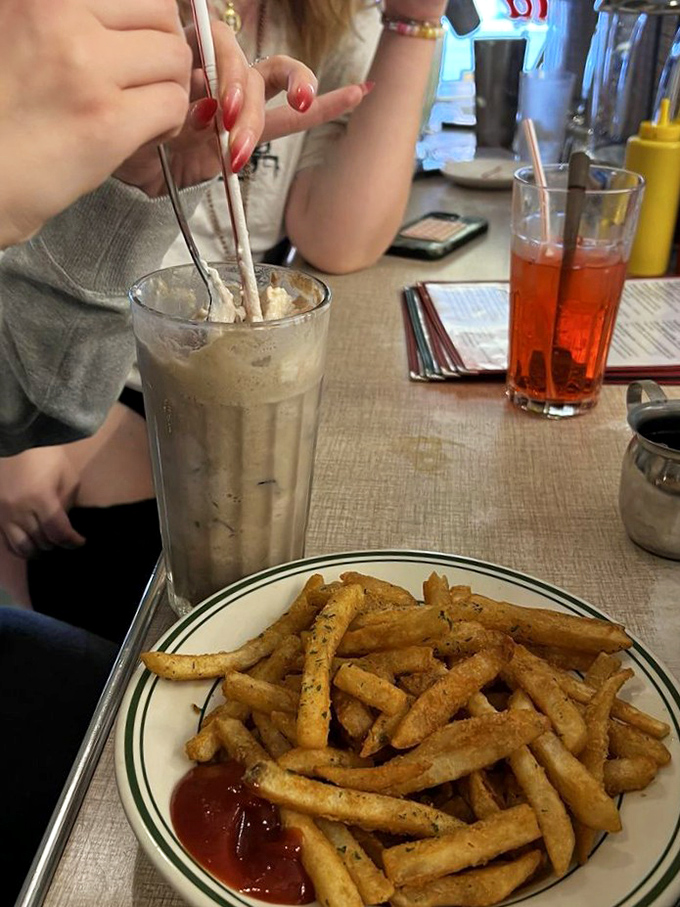 Fries before guys (or gals)! These crispy spuds paired with a creamy milkshake create a flavor combo that's nothing short of magic. Dip if you dare!