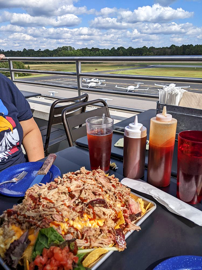 Pulled pork perfection that'll make you want to hug the pitmaster. It's like a flavor explosion in every forkful.