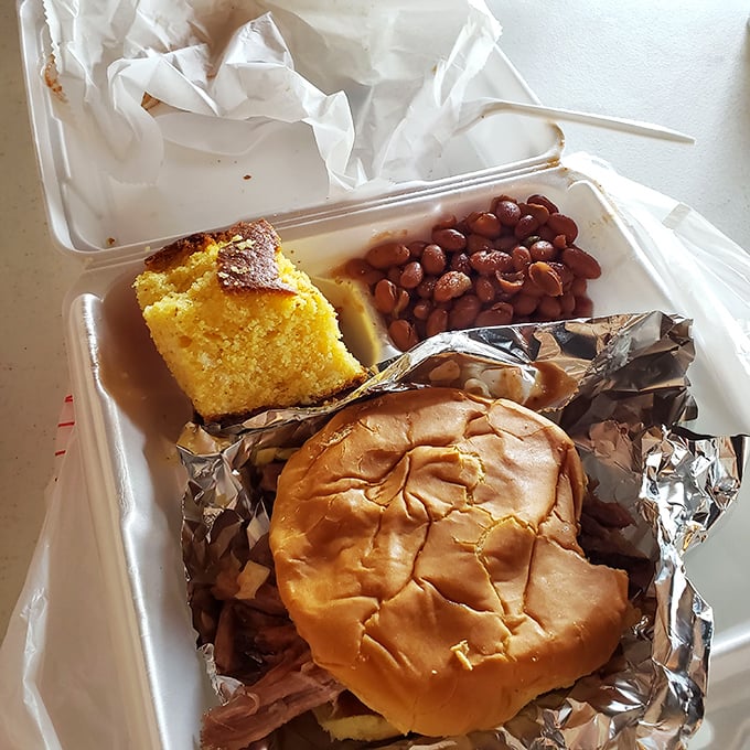 This pulled pork sandwich isn't just a meal; it's a handheld flavor explosion. No utensils required, just bring your appetite.