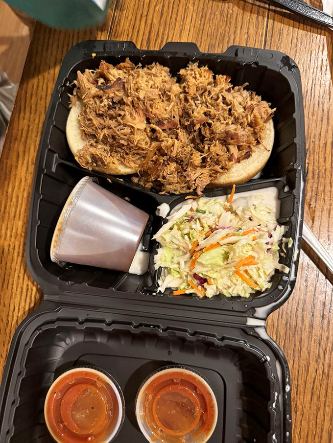Pulled pork perfection! This sandwich is so packed, it's like a meaty hug between two buns.