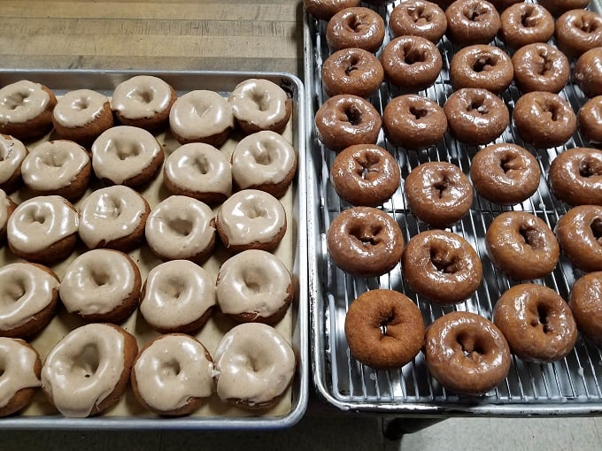 Fall in a bite! These pumpkin cake donuts are like a warm hug from your favorite sweater, but with 100% more frosting.