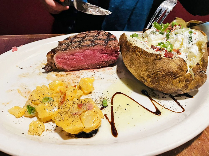 A steak that deserves its own soundtrack. That perfect medium-rare center isn't just cooking&mdash;it's culinary poetry on a white porcelain canvas.