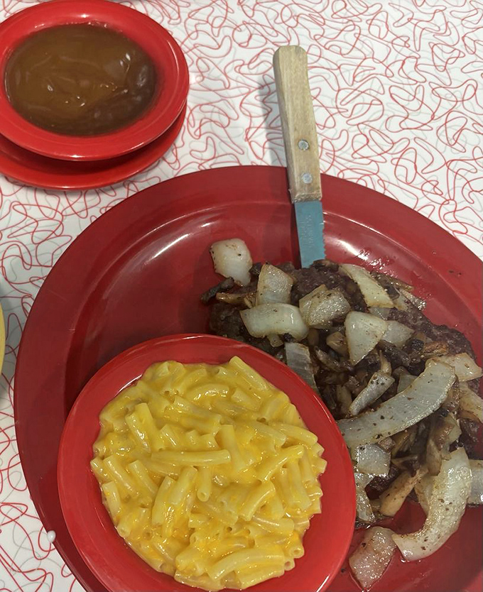 Comfort food alert! This Salisbury steak with mac and cheese is like a warm hug from your grandma, if your grandma was a culinary genius.