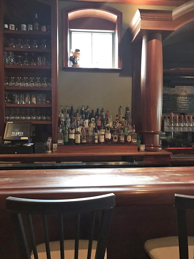 The bar at Armsby Abbey isn't just where drinks are served; it's where liquid artistry meets woodworking craftsmanship in perfect harmony.