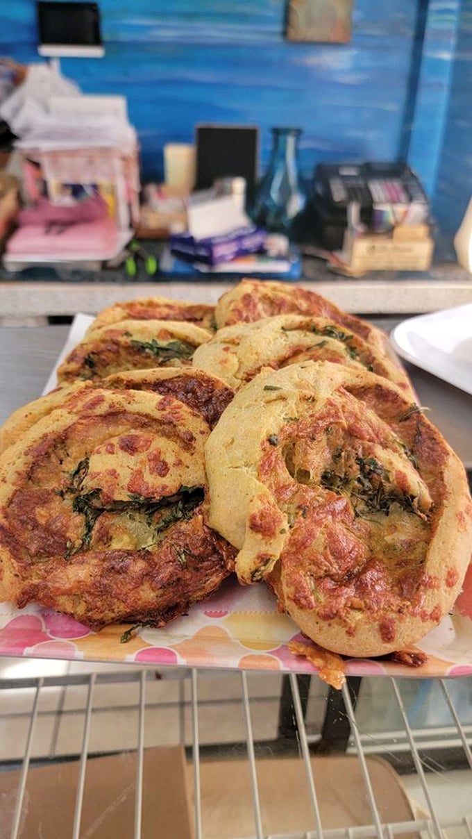 Pesto perfection in paradise! This vibrant green roll nestled among tropical flowers is giving me serious "Eat, Pray, Love" vibes. Julia Roberts would approve.