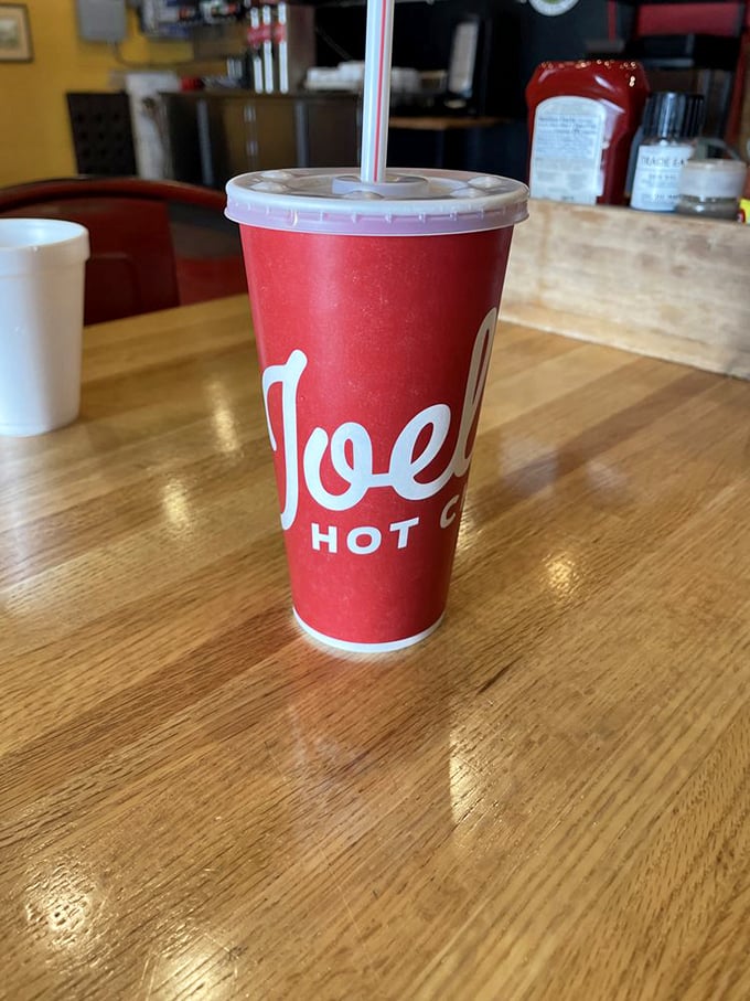 Quench your thirst in style. This cup isn't just holding a drink; it's holding the key to cool relief from the chicken heat.