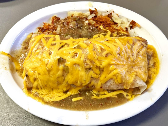 Breakfast burrito or edible work of art? This cheese-draped beauty is ready for its close-up &ndash; and your eager fork.