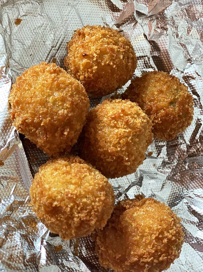 Cue balls: the appetizer that'll make you forget about billiards. These golden orbs of deliciousness are a slam dunk for your taste buds.